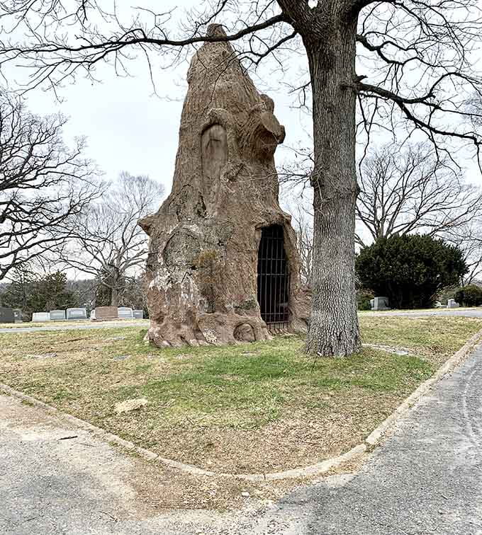 Nature reclaimed this hollow tree monument, creating something both haunting and strangely beautiful to behold here.
