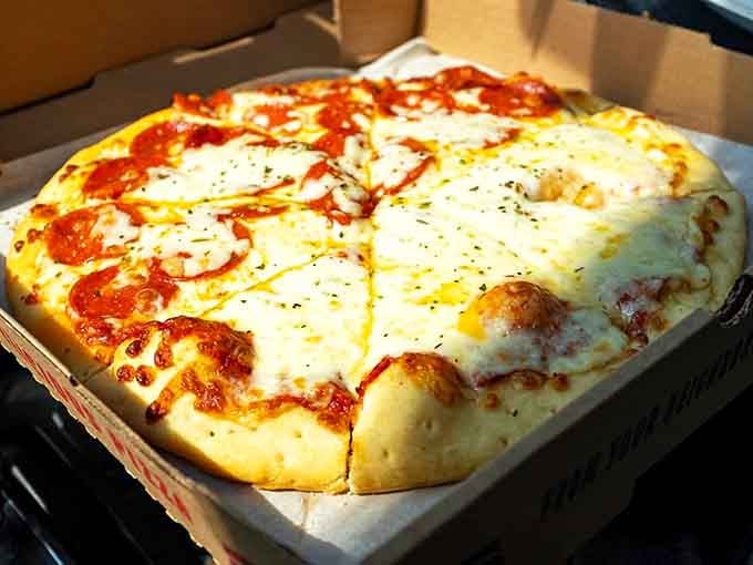 The classic half-and-half pizza, solving family debates since forever and looking absolutely gorgeous while doing it.