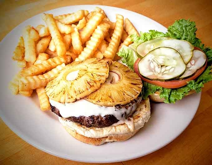 That Hawaiian burger with grilled pineapple is basically a tropical vacation you can hold in your hands.