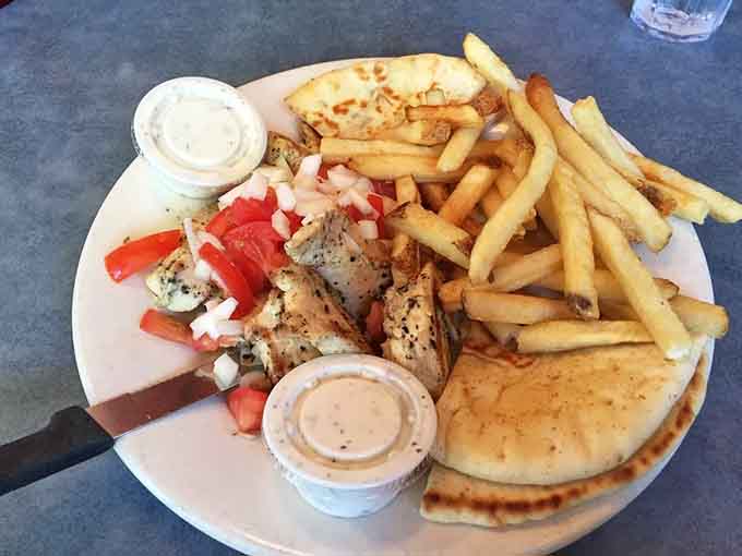 Grilled chicken, warm pita, crispy fries, and enough flavor to make you forget every bland meal you've ever eaten.