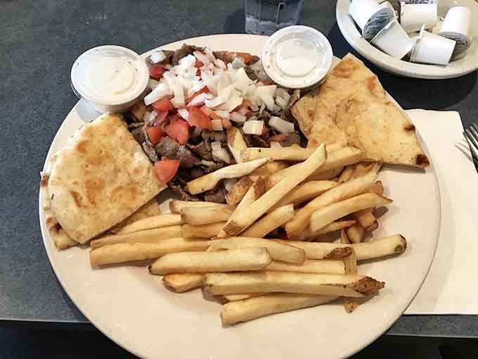 A gyro platter with golden fries that transports you straight to the Mediterranean without leaving your Denver neighborhood.