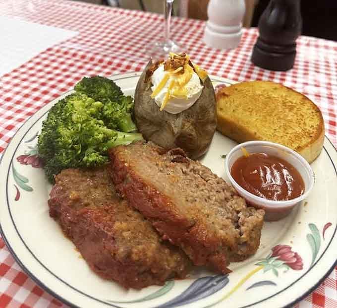 Homestyle meatloaf with a loaded potato that's practically bursting makes you remember why comfort food earned its name.