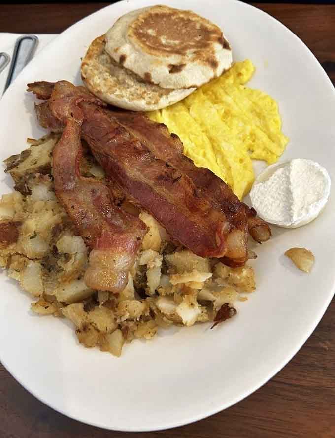 The breakfast plate that answers every morning craving simultaneously, from crispy bacon to fluffy eggs and beyond.