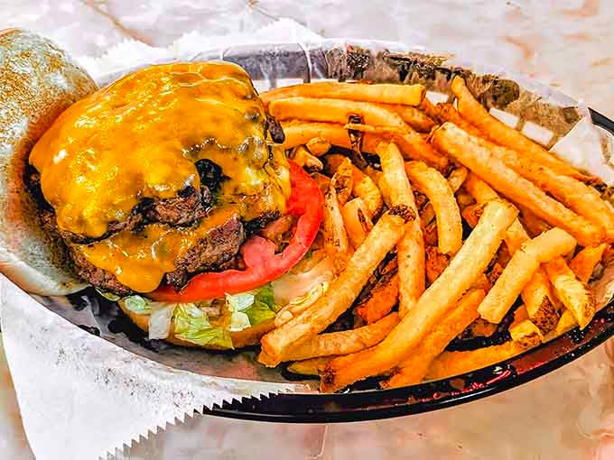 Melted cheese cascading over a juicy burger with fresh-cut fries is basically everything right with American diner culture today.