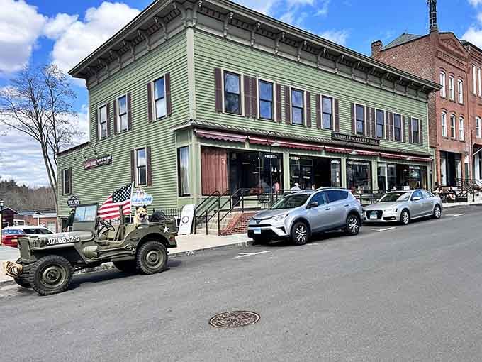 Main Street Collinsville, where that vintage Jeep fits right in and modern SUVs look like they're visiting from the future.