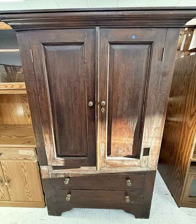 This dark wood cabinet has survived decades and looks ready to guard your belongings for decades more.