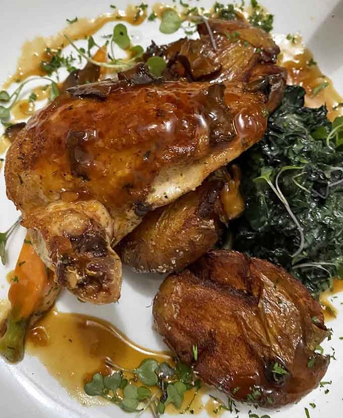 Herb-roasted chicken with crispy potatoes and greens shows that comfort food can absolutely wear its Sunday best.