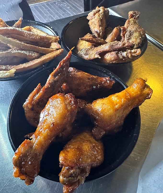 Wings and fries looking like they just won the lottery &ndash; golden, crispy, and ready for their close-up.
