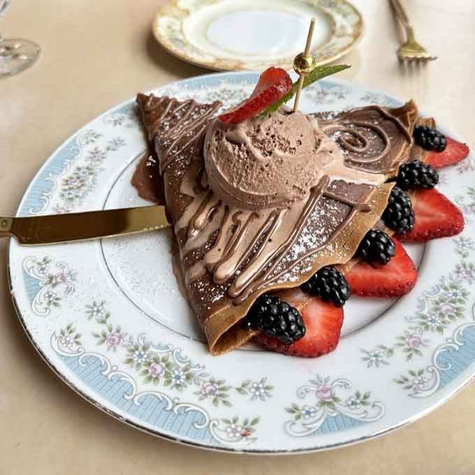 Chocolate mousse piled this high should come with a warning label about spontaneous happiness and possible swoon risk.