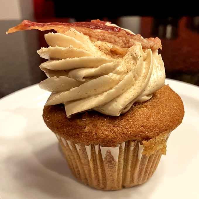 Maple frosting crowned with actual bacon, proving that breakfast desserts are a legitimate life choice now.