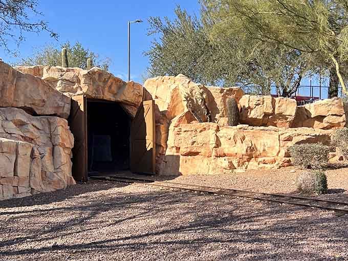 Yes, that's an actual tunnel carved into faux rock, because even miniature trains deserve dramatic entrances.