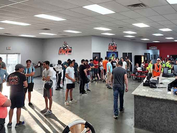 Race day energy fills the room as drivers gather, their excitement practically vibrating off the walls.