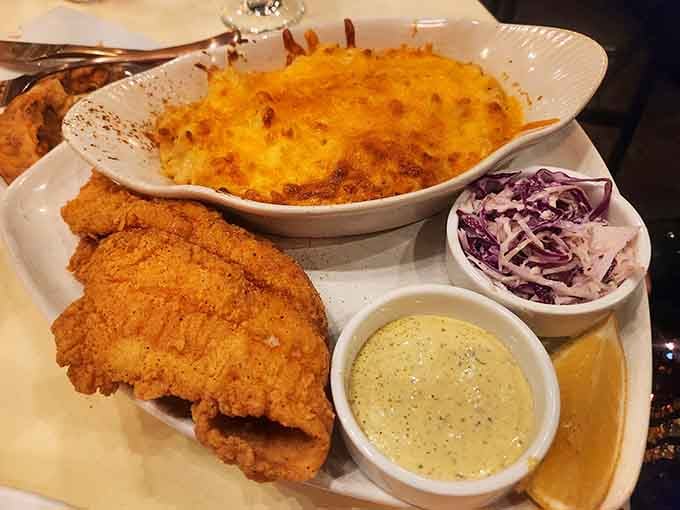 That golden-fried fish paired with bubbling mac and cheese is comfort food elevated to an art form.