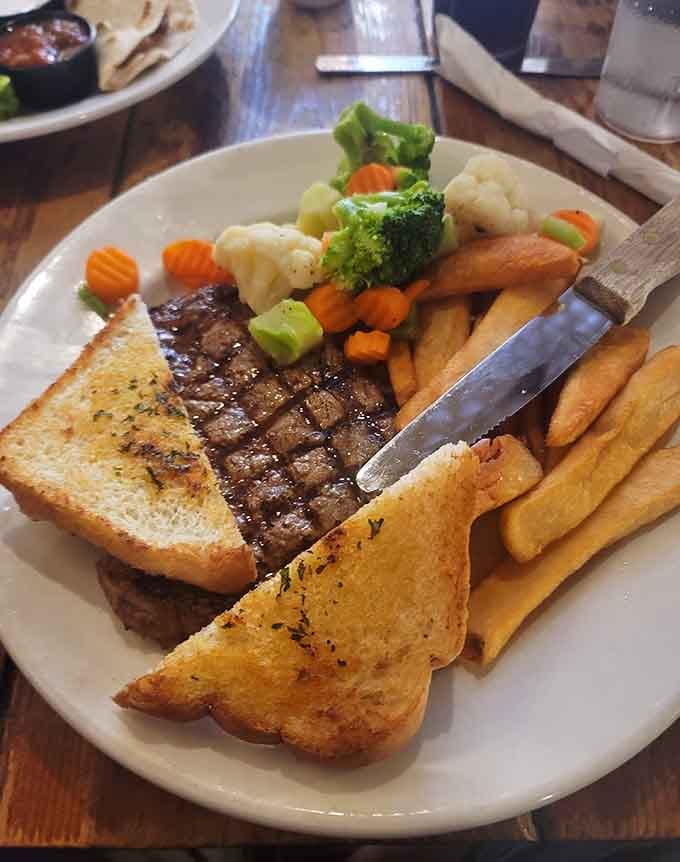 Ribeye steak with all the trimmings, because subtlety has no place at a proper Western saloon dinner.