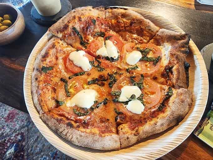 Fresh mozzarella and basil on a wood-fired pizza pairs with wine better than most things pair with anything.