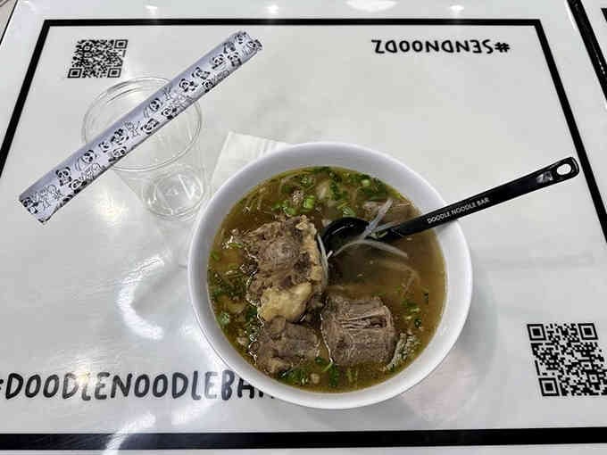 Oxtail pho so rich and flavorful, it transcends the black-and-white world surrounding it with pure taste.