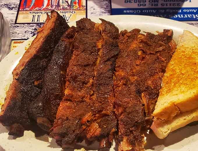 These ribs have that beautiful dark bark that tells you someone back there really knows what they're doing with smoke.