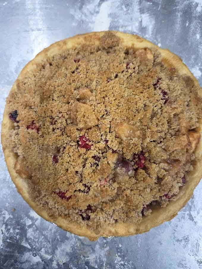 Crumble topping so generous it practically defies gravity, hiding fruit treasures beneath its buttery blanket of deliciousness.