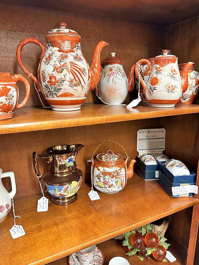 Teapots in coral and cream that make you want to host fancy afternoon tea immediately, crumpets optional.