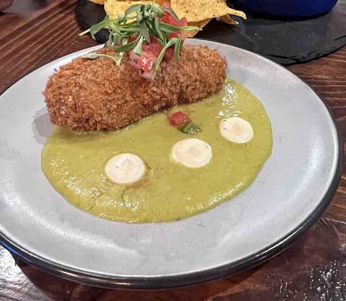 Crispy birria croquettes swimming in vibrant green salsa might just be the most genius fusion you'll taste this year.