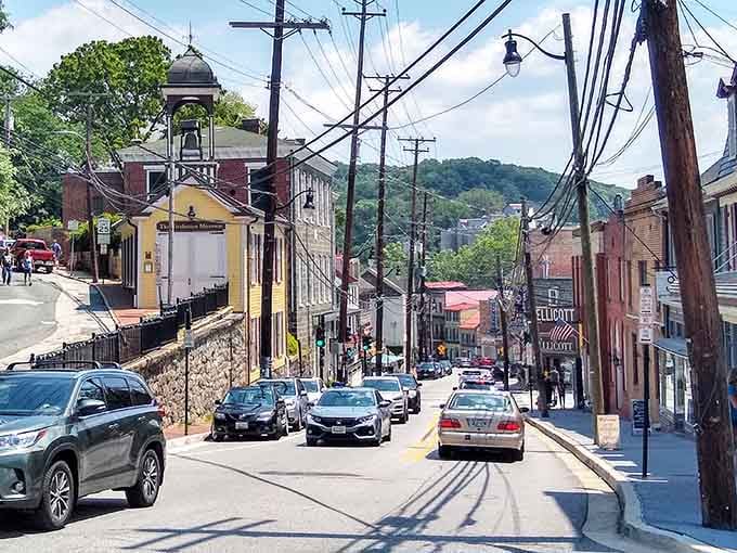 The street slopes and curves with the confidence of a city that never needed to follow anyone else's grid system.