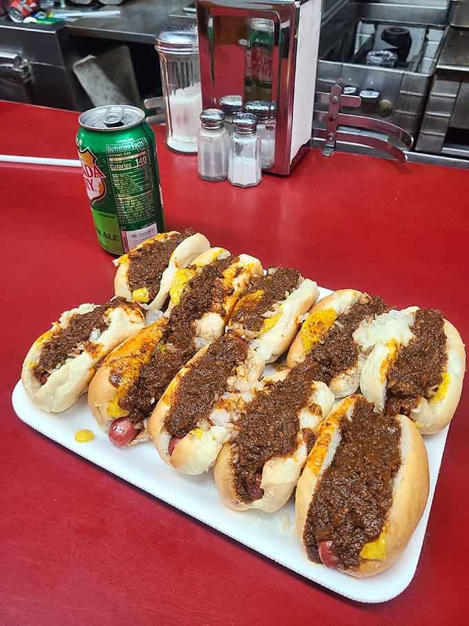 Ten mini hot dogs lined up like edible soldiers, proving that nobody orders just one when perfection comes in multiples.