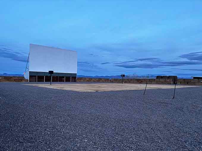 This wide-open gravel lot transforms into entertainment central once darkness falls and the projector fires up.