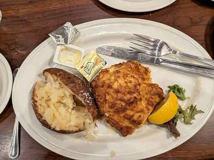 Crab cake with baked potato proves Maryland knows how to marry land and sea on one glorious plate.