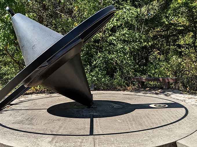 Time stands still at this striking sundial, where shadows dance across metal in nature's oldest clock design.