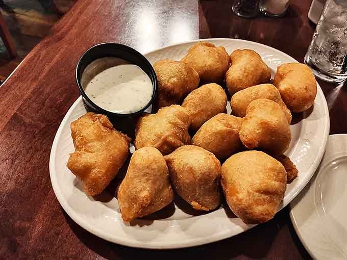 Beer-battered cheese curds golden and crispy, because Wisconsin and Switzerland should collaborate on dairy projects more often.