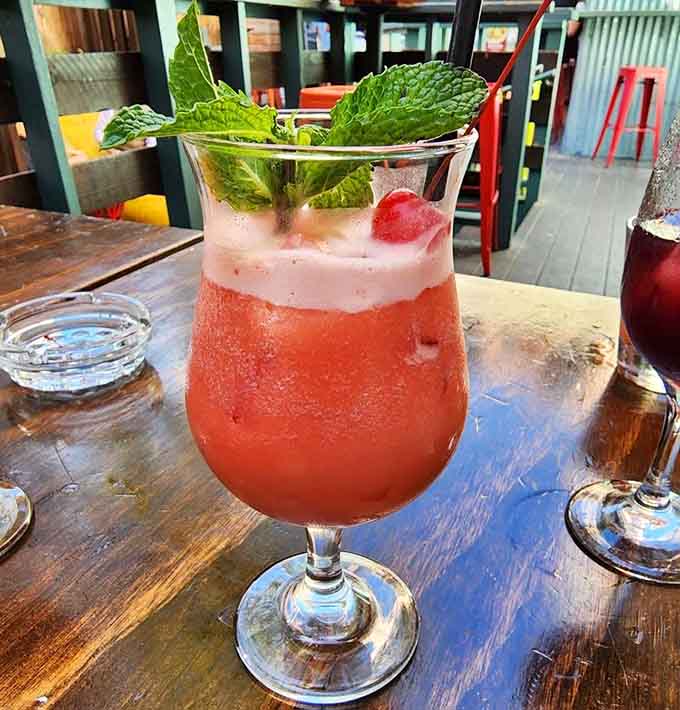 Fresh mint and strawberry create a daiquiri that's both photogenic and dangerously drinkable on a warm evening.