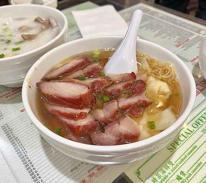 When your soup comes loaded with roast pork and wontons, you know someone in that kitchen loves you.