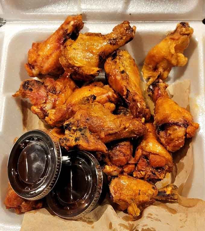 Golden, crispy wings piled high with sauce on the side, because sometimes you need options beyond ribs.