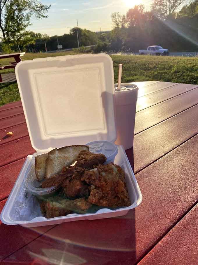 Sometimes the best meals are enjoyed at sunset on a picnic table with chicken and a cold drink.