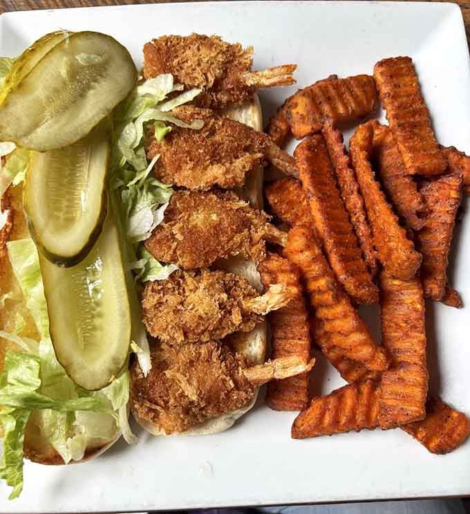 That shrimp po'boy with crispy pickles and seasoned fries is calling your name louder than your diet ever could.
