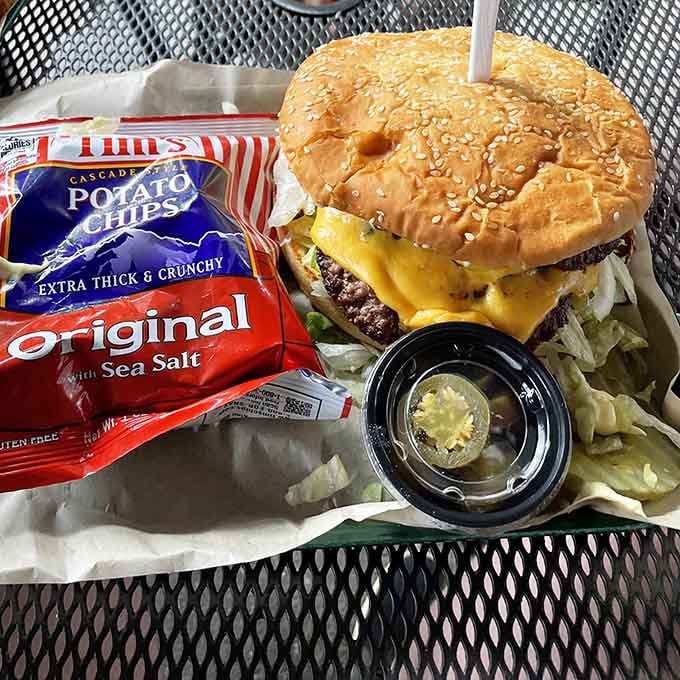 Melted cheese and a burger that laughs in the face of portion control make this meal impossible to ignore.