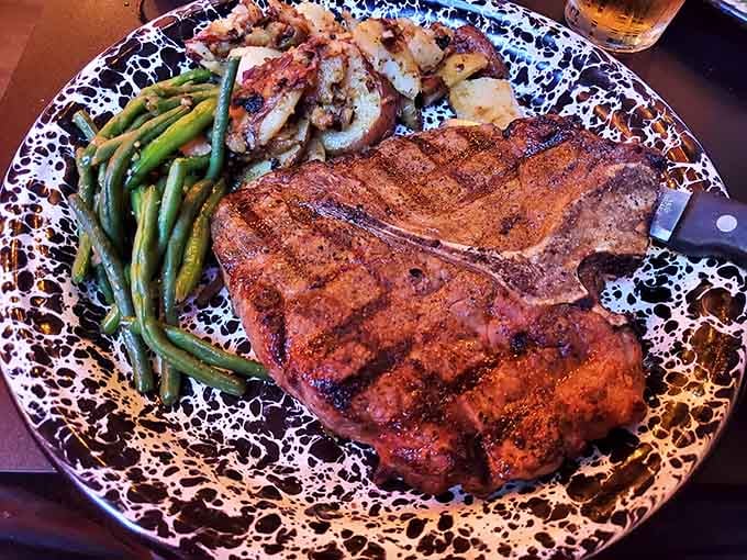 A porterhouse this beautifully charred with crab-stuffed prawns and green beans is date night done right.