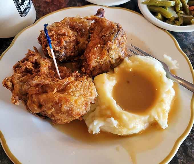 Golden fried chicken with mashed potatoes and gravy, because sometimes you need comfort food that actually comforts.