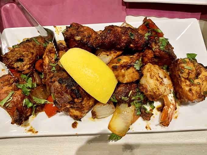 Tandoori perfection on a platter, charred and juicy enough to make you reconsider your relationship with plain grilled chicken.