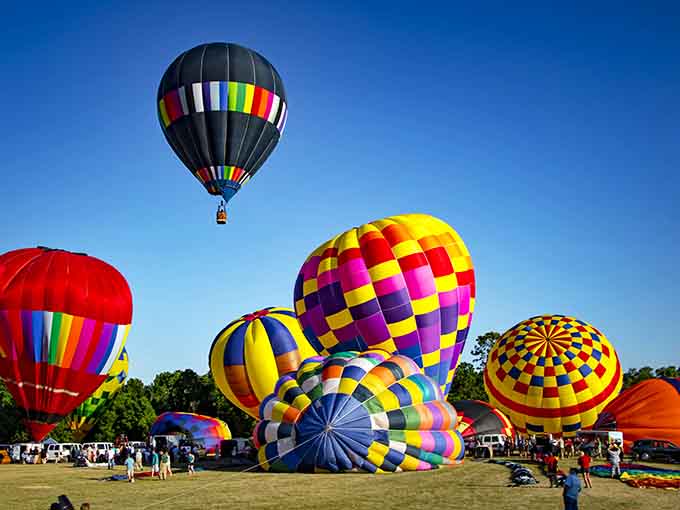 Hot air balloons fill the sky during Balloonfest, making grown adults point upward like excited kindergarteners on field trips.