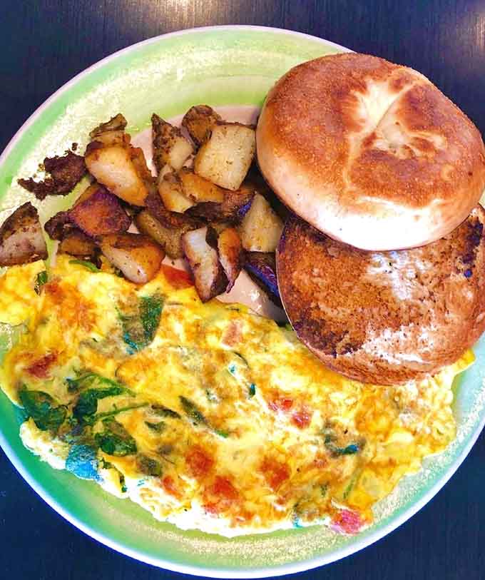 A perfectly fluffy omelet with crispy home fries&mdash;breakfast done right without any unnecessary complications here.