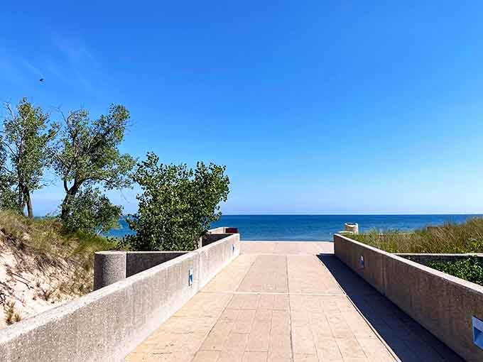 The walkway to happiness is paved, accessible, and leads straight to sandy shoreline bliss.