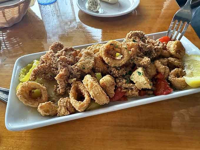 Crispy calamari rings that prove sometimes the simplest preparations are the most satisfying choices available.