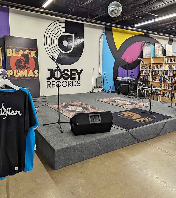 A performance stage sits ready for live music, because sometimes you need to hear it fresh.