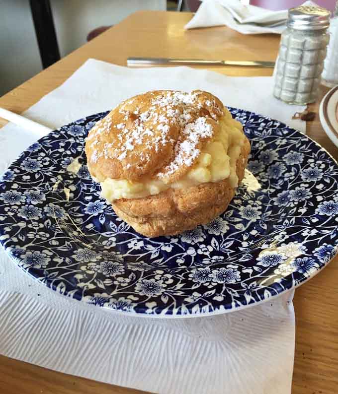 That cream puff dusted with powdered sugar is basically a cloud you can eat, and yes, you deserve it.