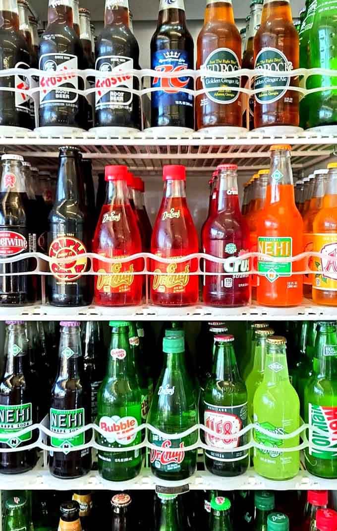 Rows of vintage glass bottle sodas waiting to become floats, like actors in the wings before showtime begins.