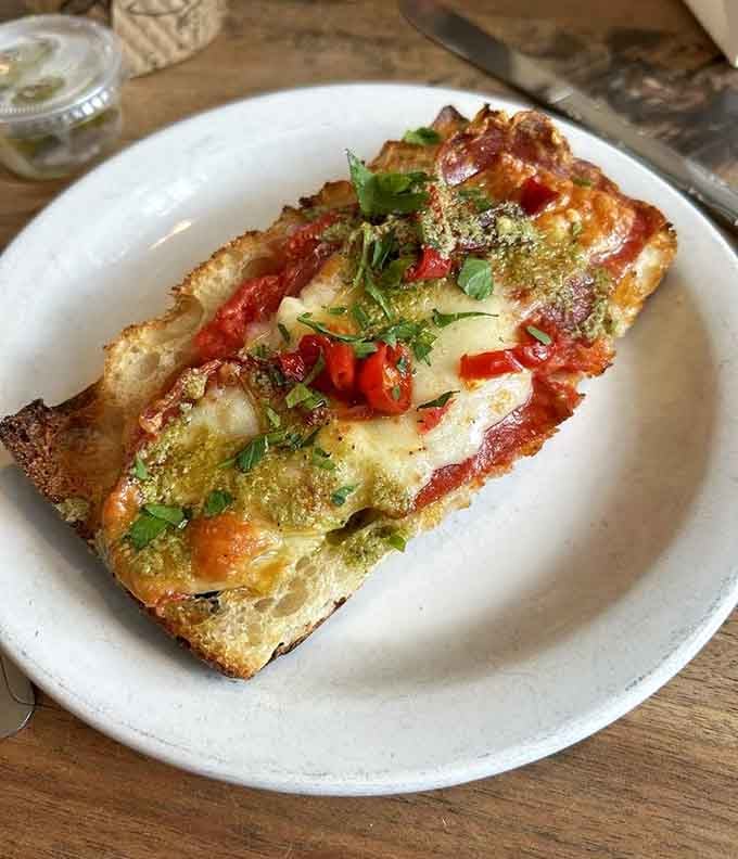 When pizza meets focaccia in the most delicious identity crisis you'll ever witness on a plate.