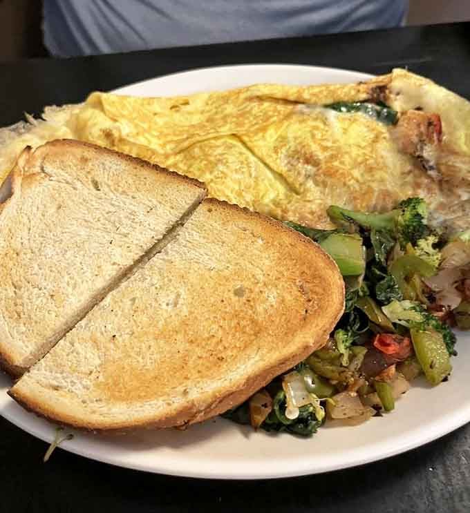 This omelet is stuffed with vegetables and melted cheese, proving breakfast can be both hearty and healthy.