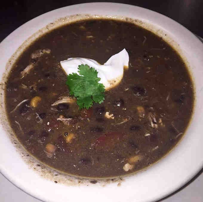 Rich black bean soup topped with sour cream, because sometimes dark and mysterious wins the day.