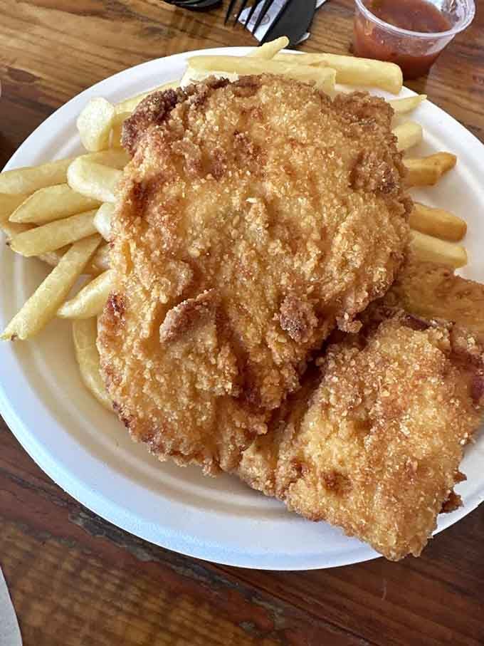 Golden, crispy fish and chips that would make any British pub jealous of this desert operation.